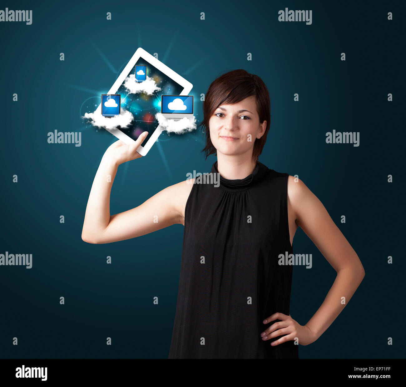 young woman holding tablet with modern devices in clouds Stock Photo ...