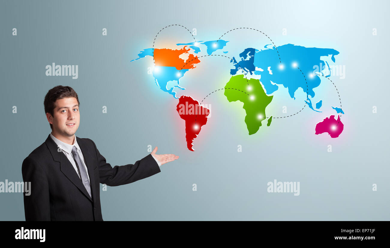 young man presenting colorful world map Stock Photo - Alamy