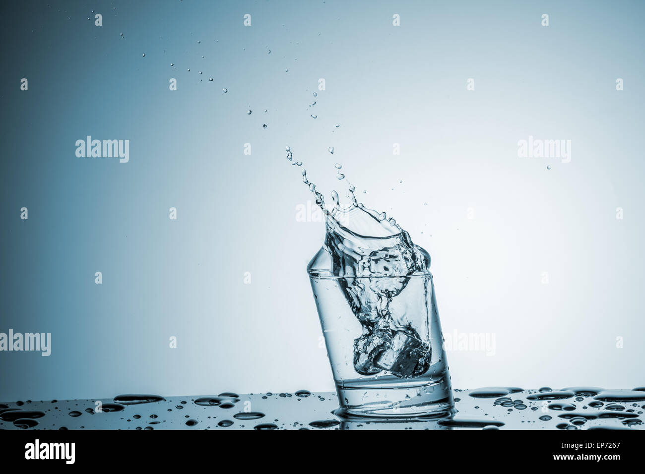 Water in glass with water splash Stock Photo - Alamy