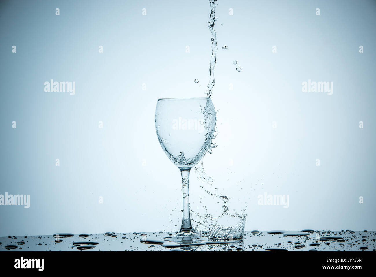 glass being filled with water Stock Photo - Alamy