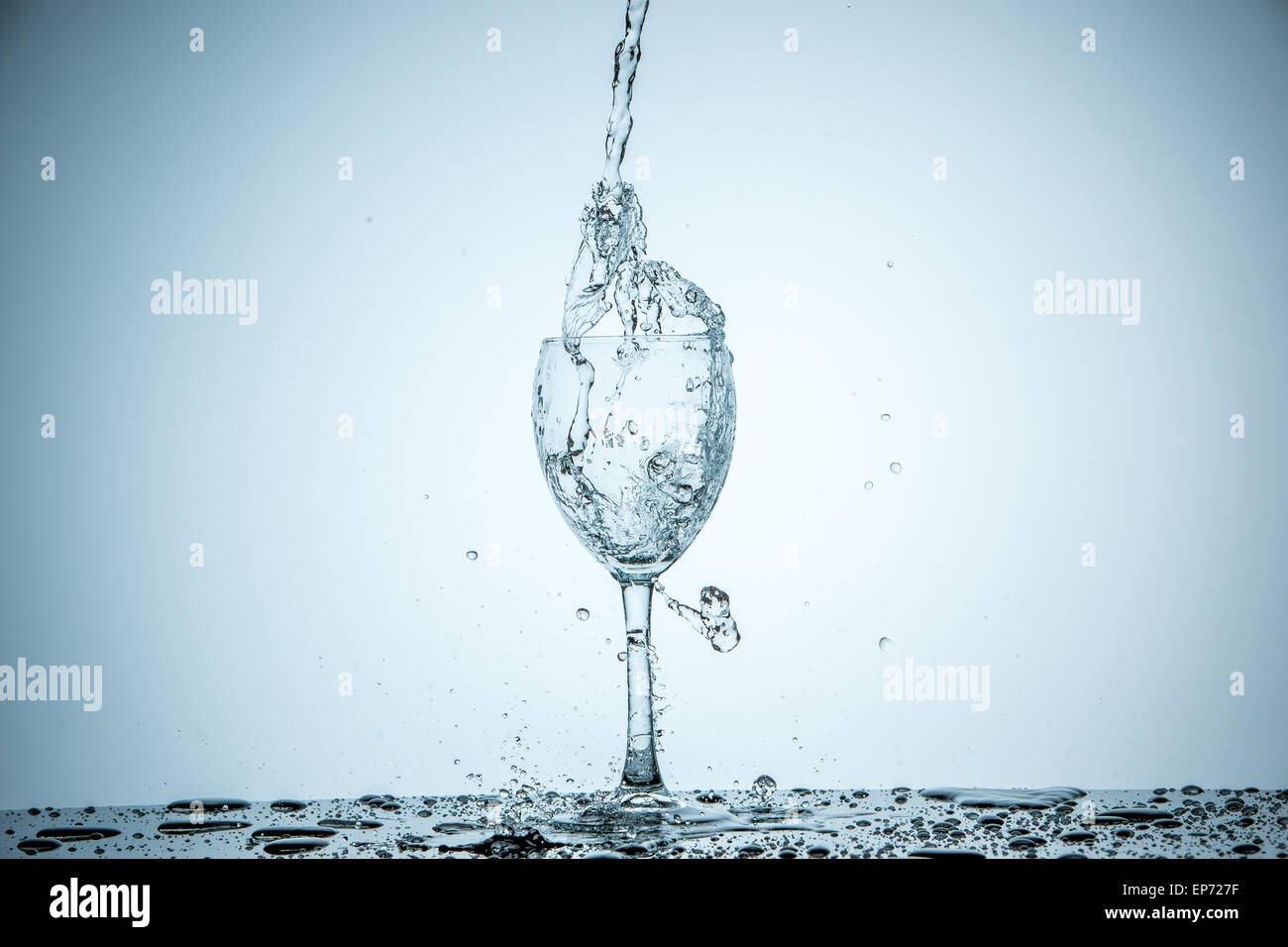glass being filled with water Stock Photo - Alamy