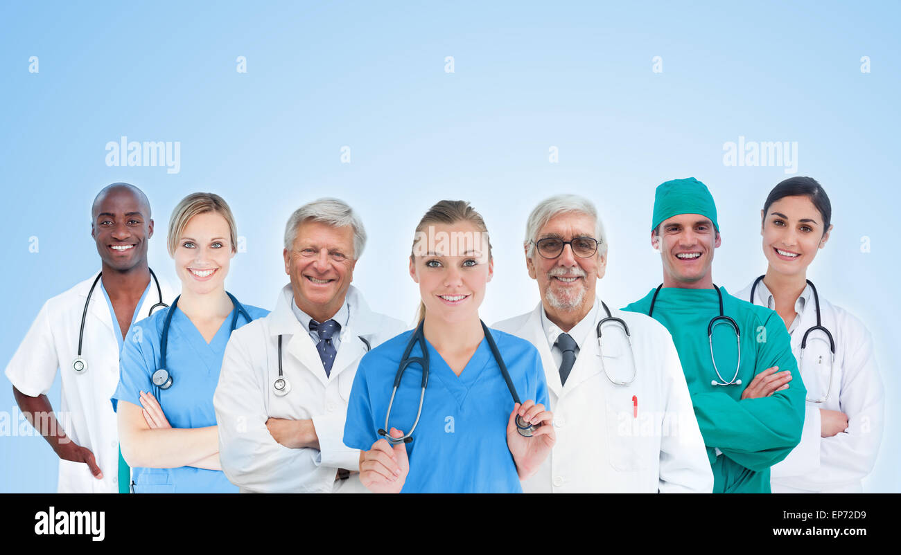 Medical team standing in line on blue background Stock Photo - Alamy