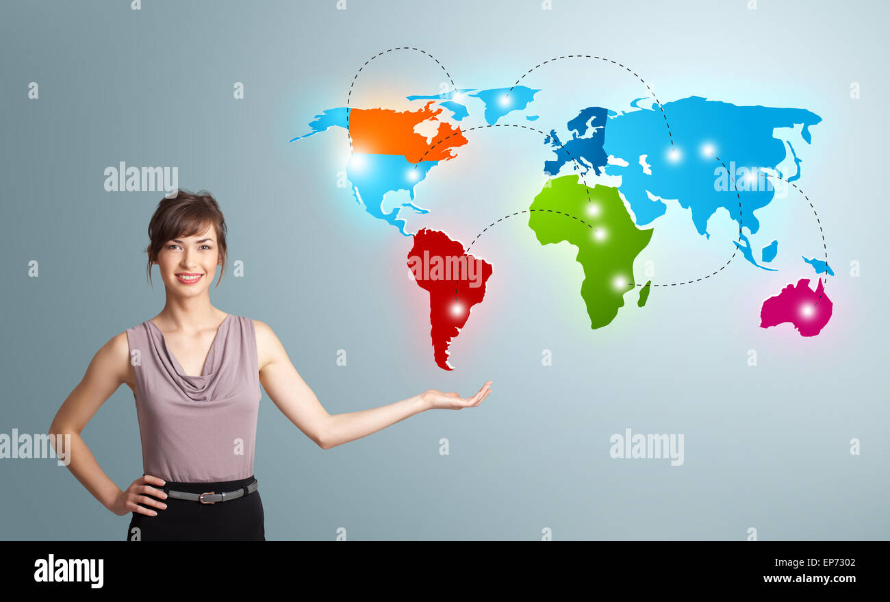 Young woman presenting colorful world map Stock Photo - Alamy