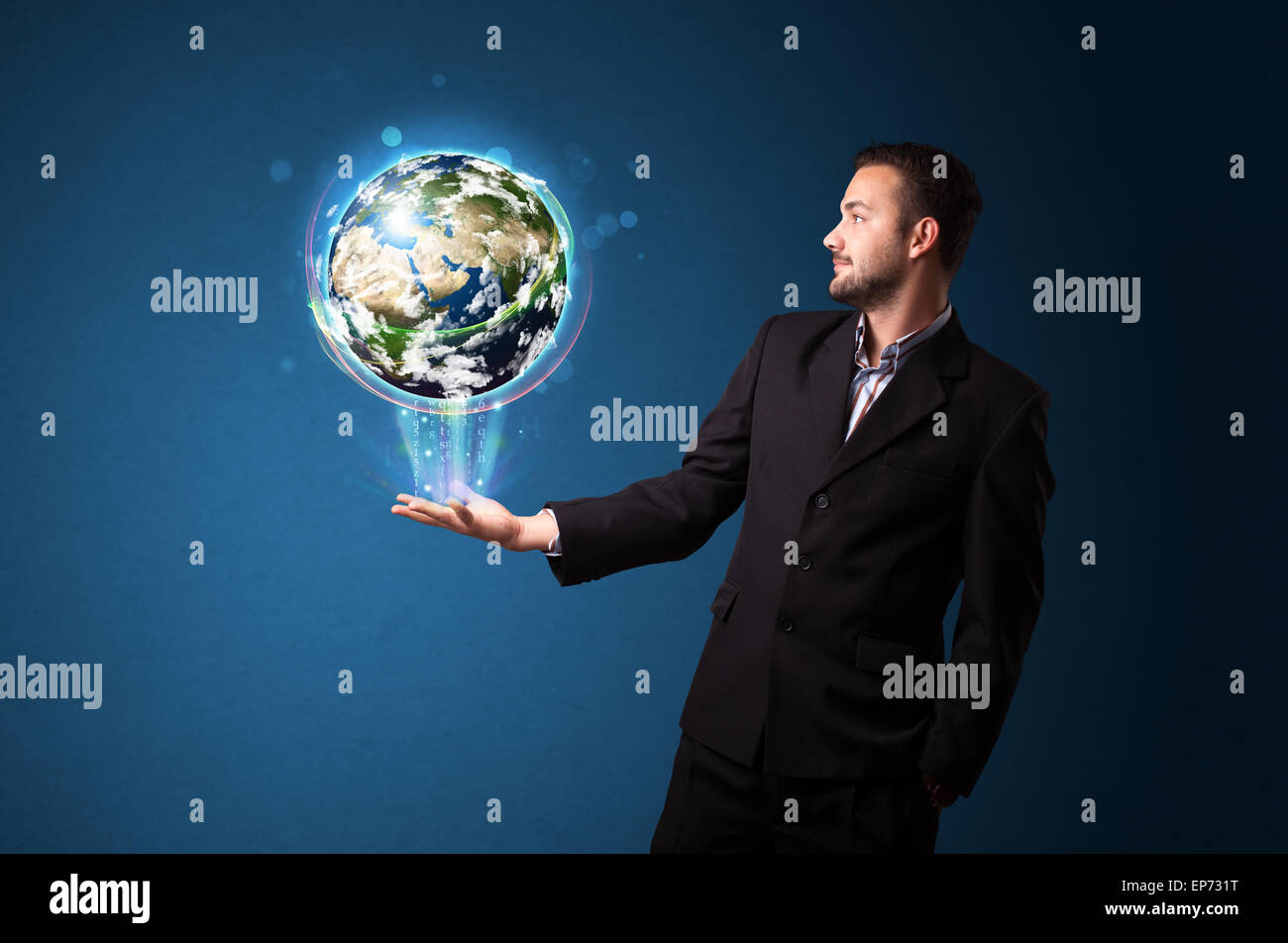 Businessman Holding Glowing Earth Globe Stock Photo Alamy