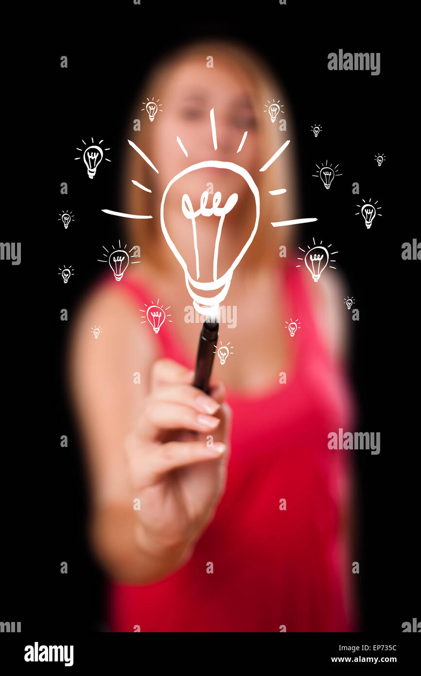 Woman drawing light bulb on whiteboard Stock Photo - Alamy
