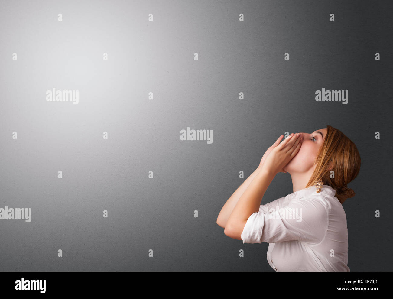 Young woman making gestures Stock Photo - Alamy