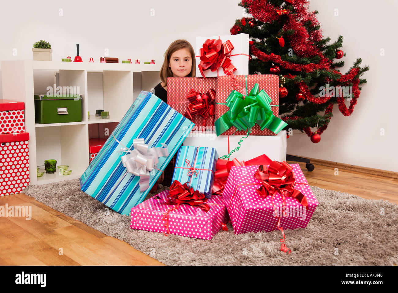 Happy kids with christmas present Stock Photo - Alamy