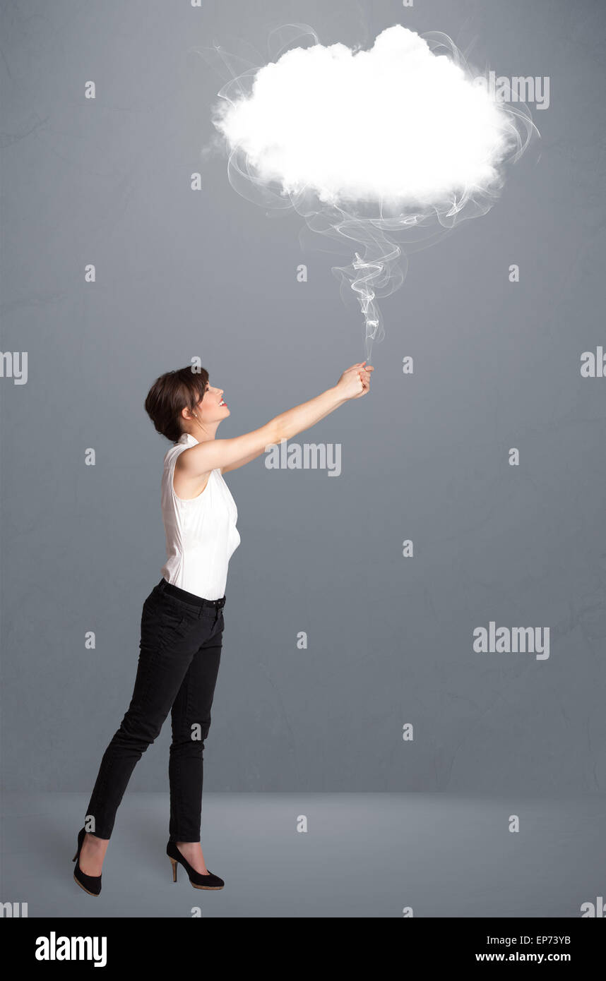Beautiful lady holding cloud Stock Photo - Alamy