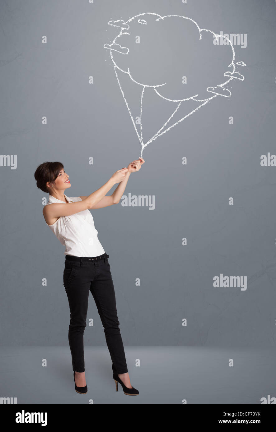 Pretty lady holding a cloud balloon drawing Stock Photo - Alamy