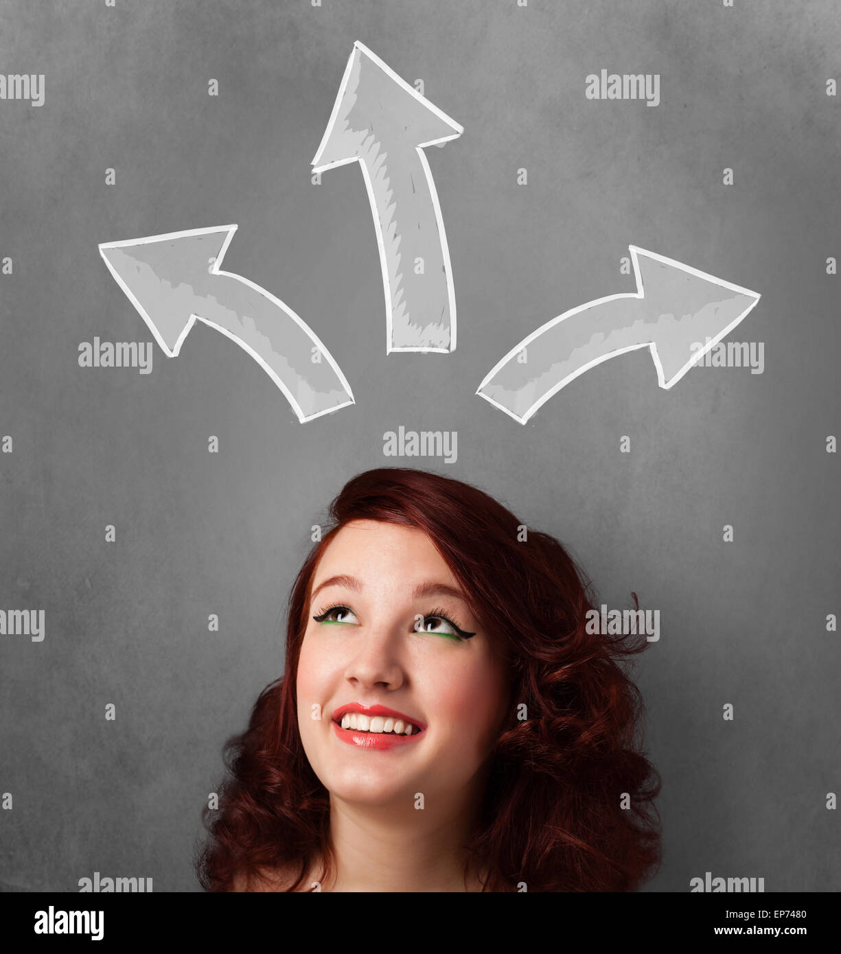Young woman thinking with arrows above her head Stock Photo - Alamy