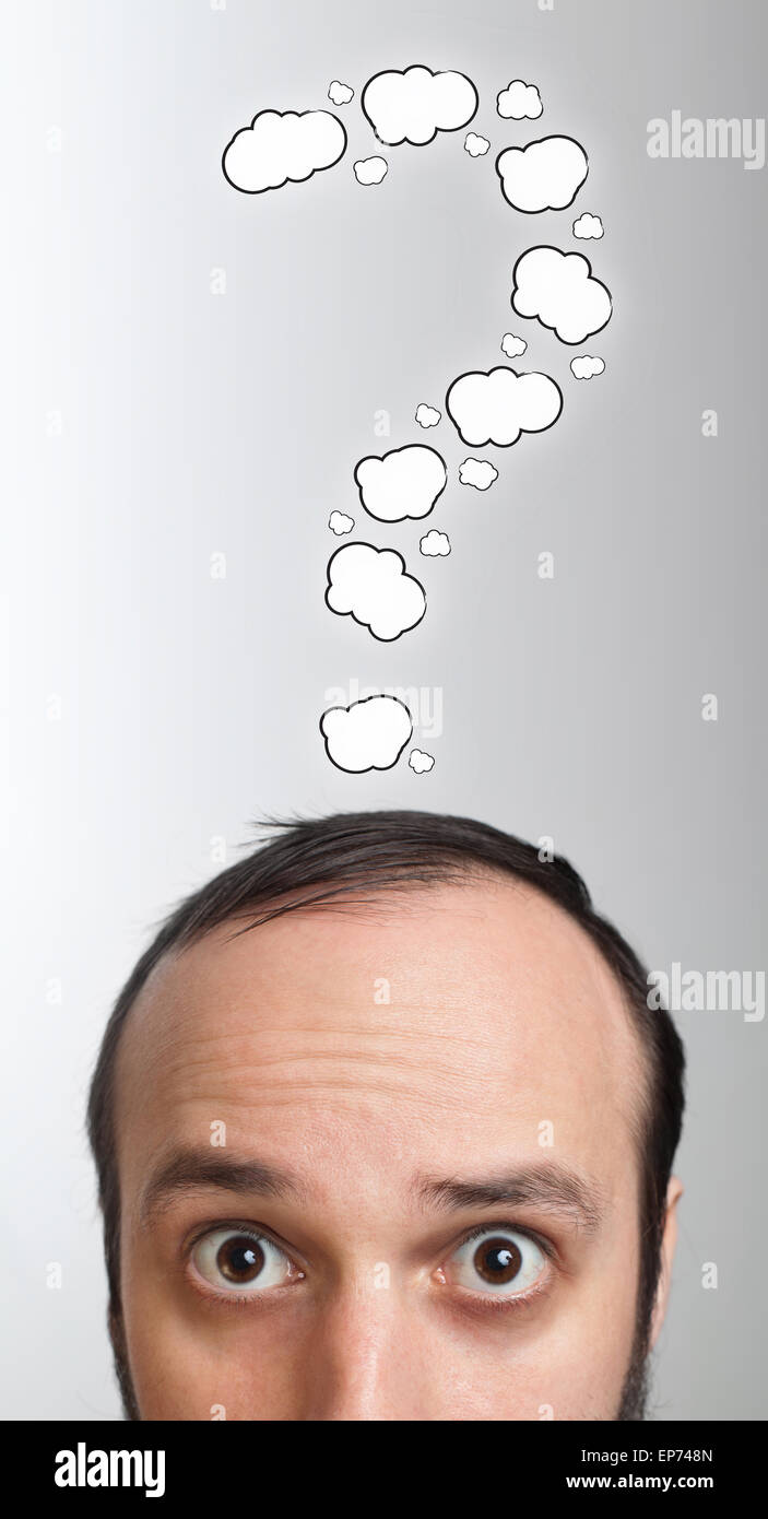 Young guy with question mark over his head Stock Photo - Alamy