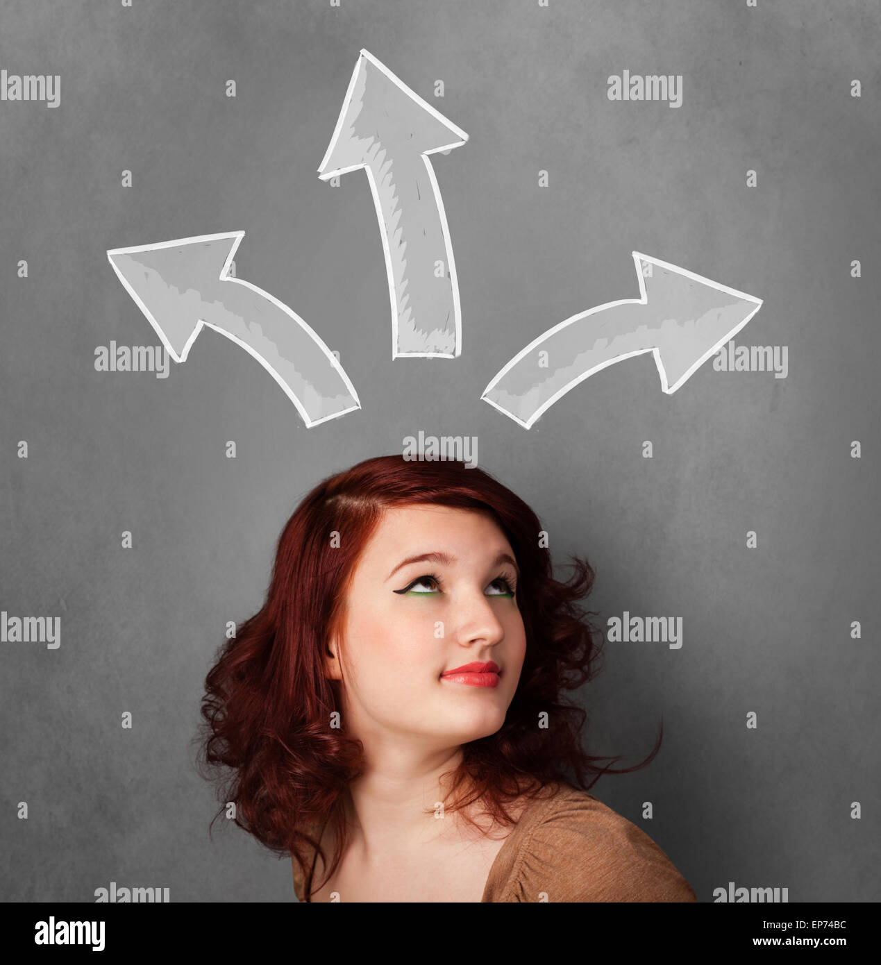 Young woman thinking with arrows above her head Stock Photo - Alamy