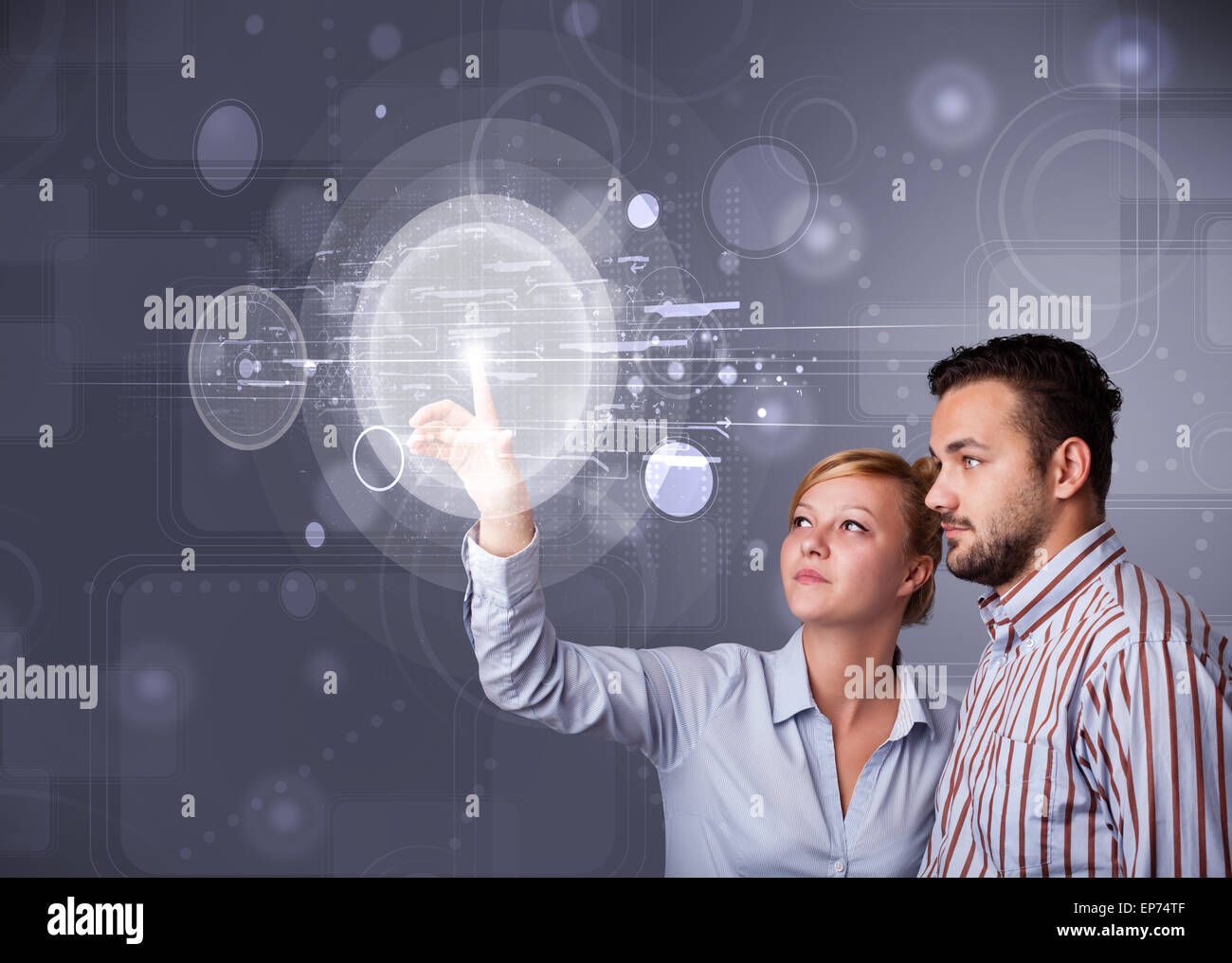 Happy couple touching abstract high technology circular buttons Stock ...