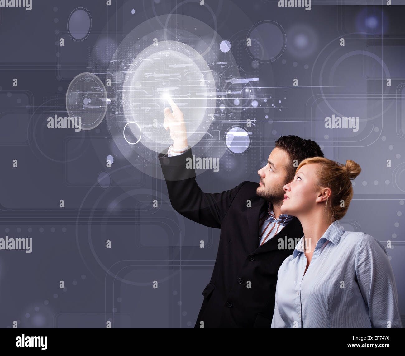 Happy couple touching abstract high technology circular buttons Stock ...
