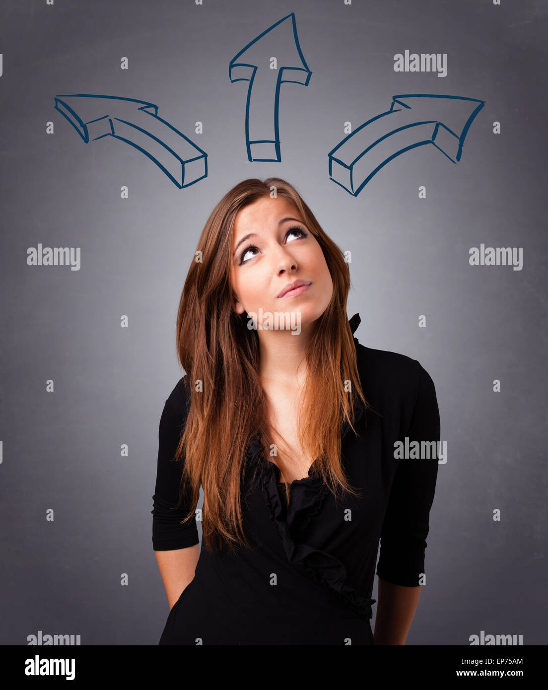Pretty lady thinking with arrows overhead Stock Photo - Alamy