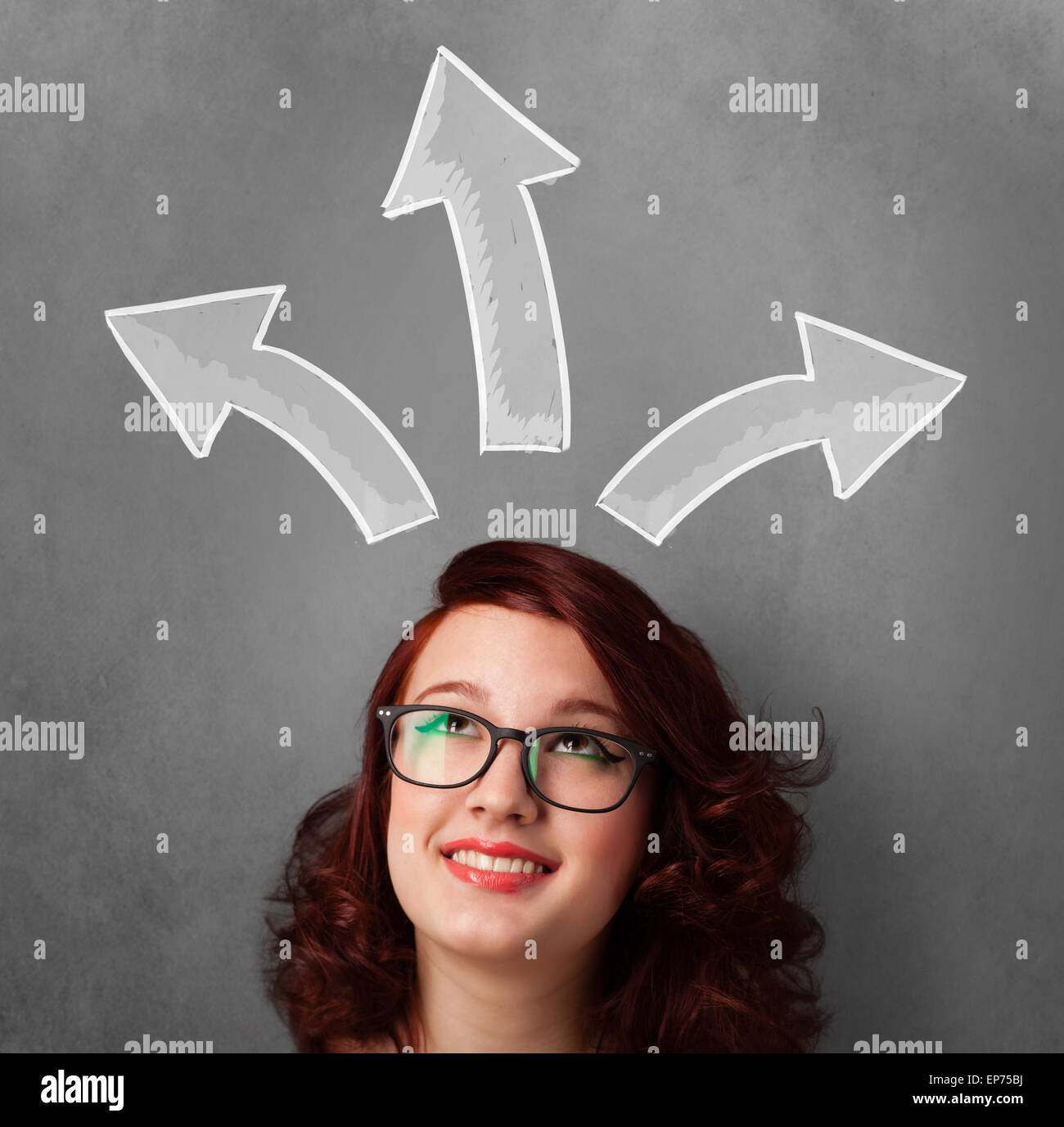 Young woman thinking with arrows above her head Stock Photo - Alamy