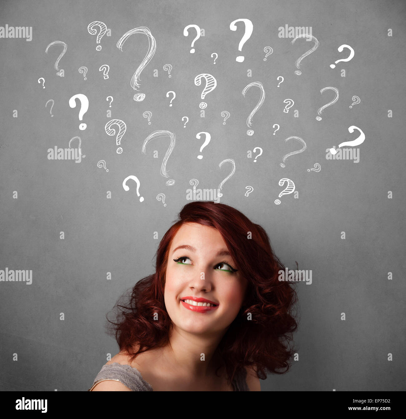 Young woman with question marks above her head Stock Photo - Alamy