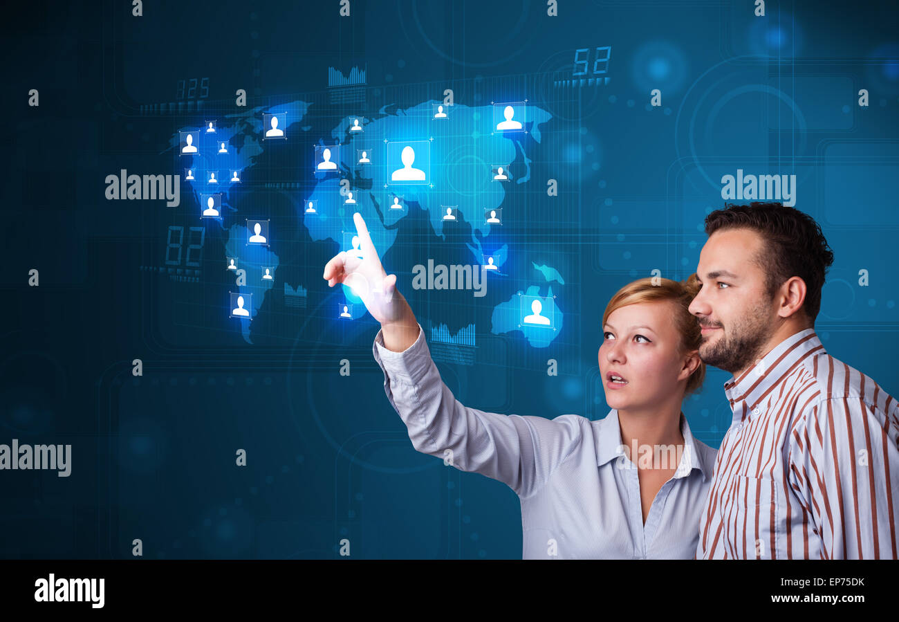 Young couple choosing from social network map Stock Photo - Alamy
