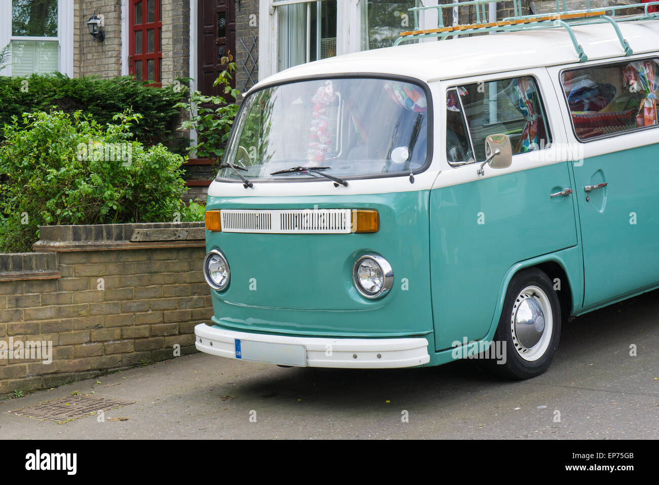 Camper Van parked outside a house Stock Photo - Alamy