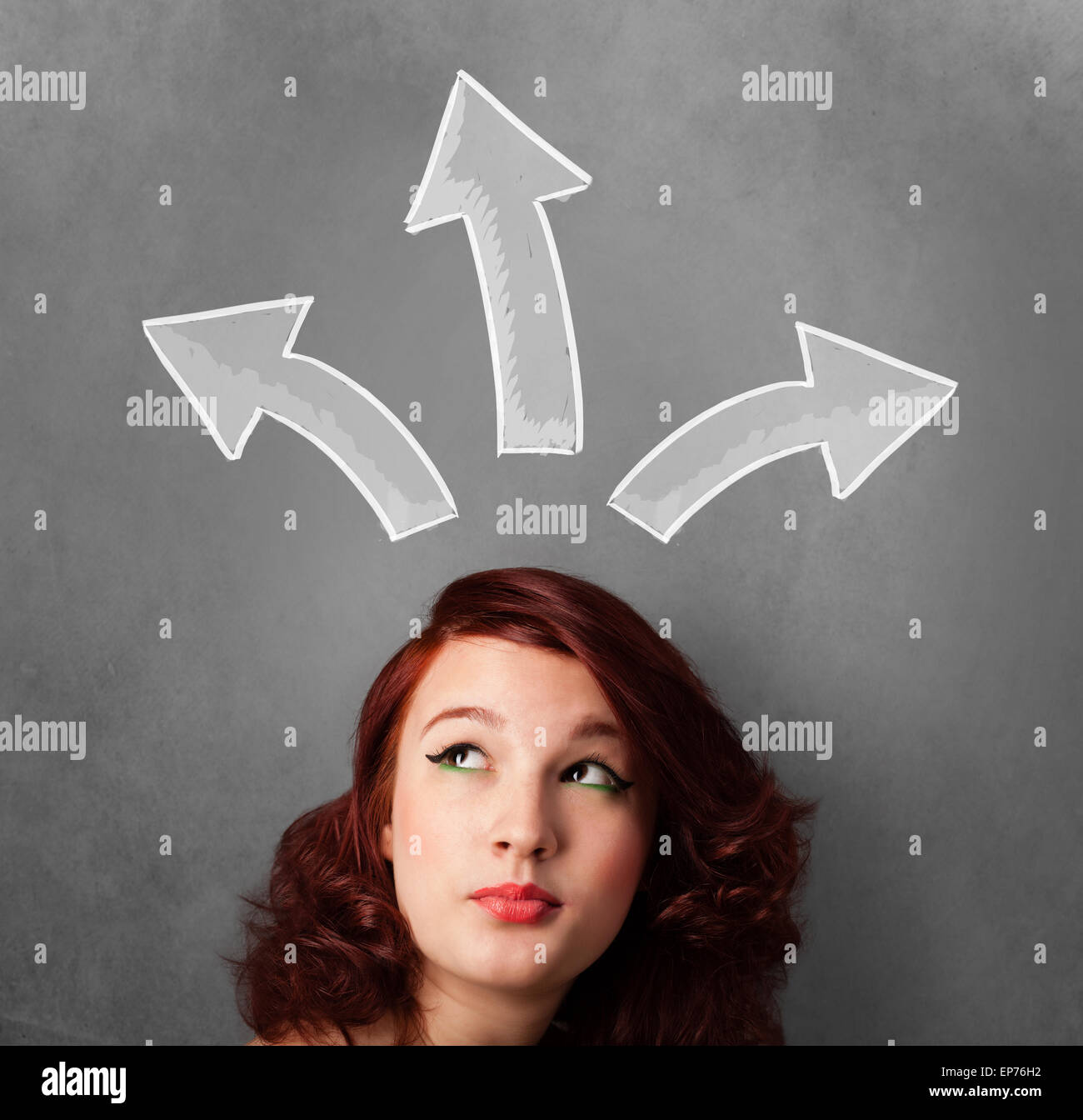 Young woman thinking with arrows above her head Stock Photo - Alamy
