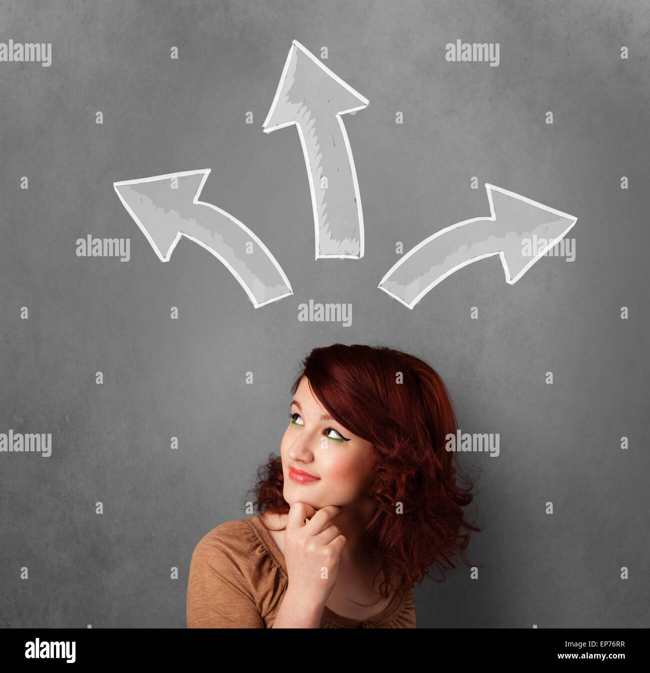 Young woman thinking with arrows above her head Stock Photo - Alamy