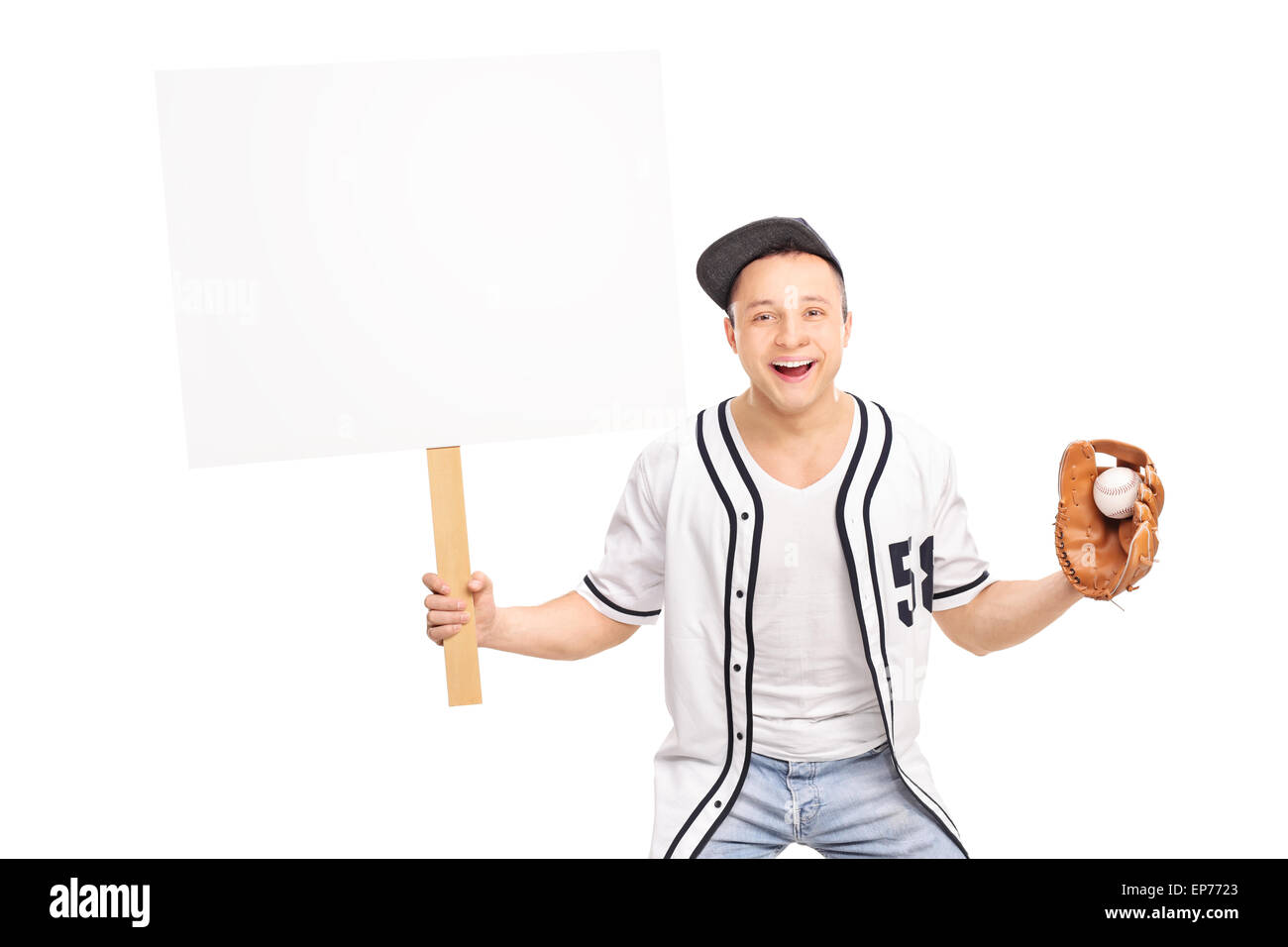 Excited baseball fan holding a ball and a blank banner and looking at ...