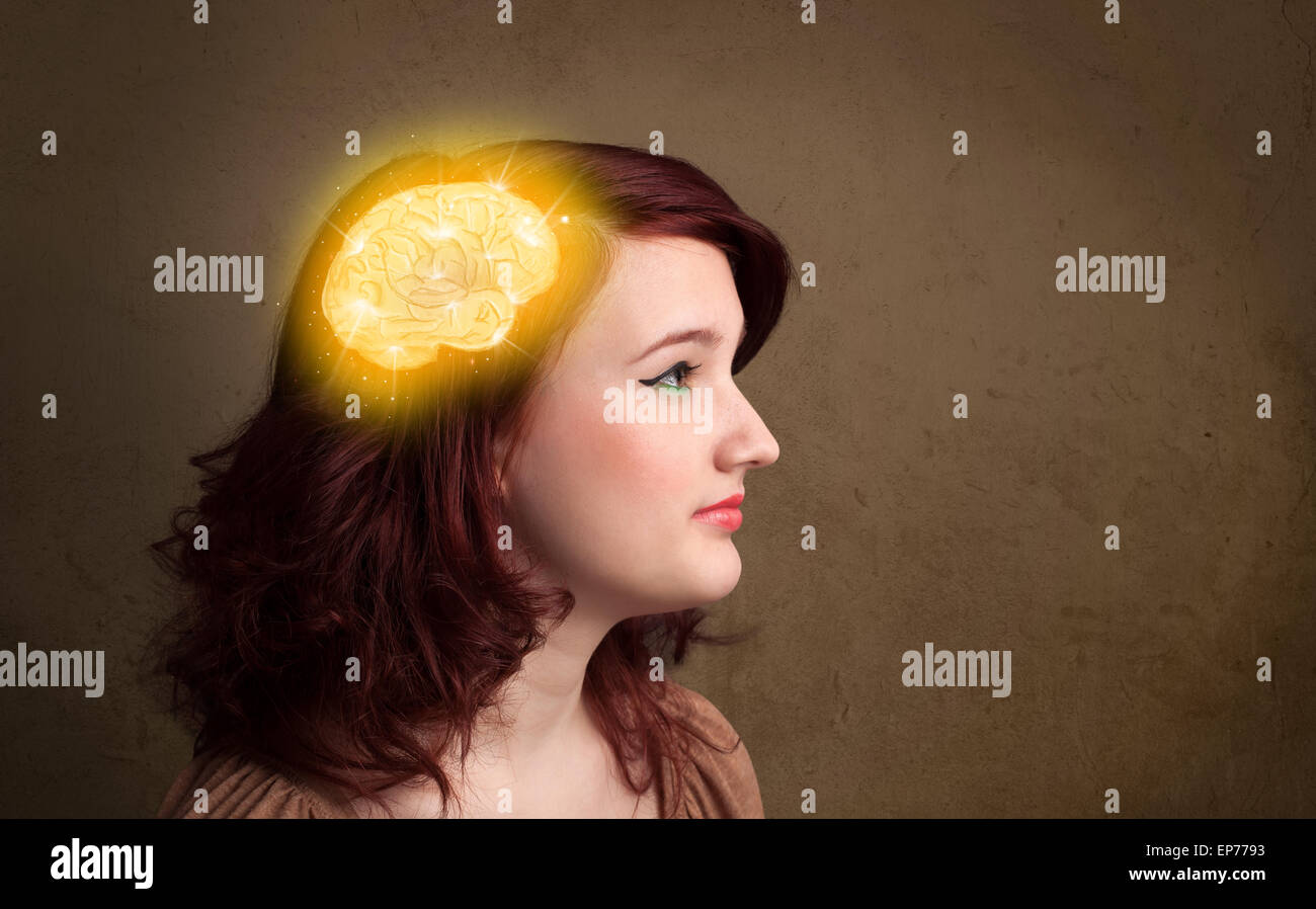 Young girl thinking with glowing brain illustration Stock Photo - Alamy