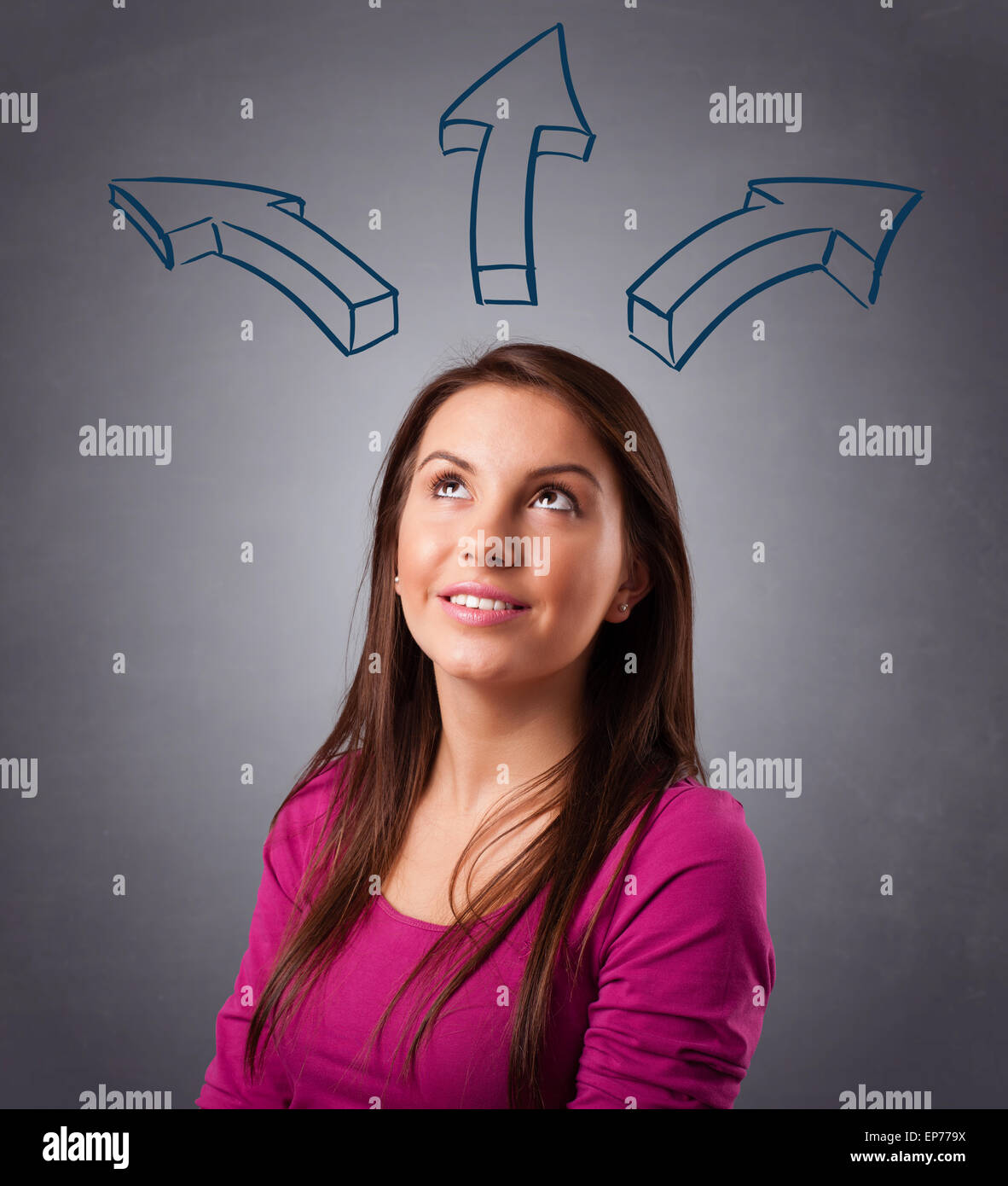 Pretty lady thinking with arrows overhead Stock Photo - Alamy