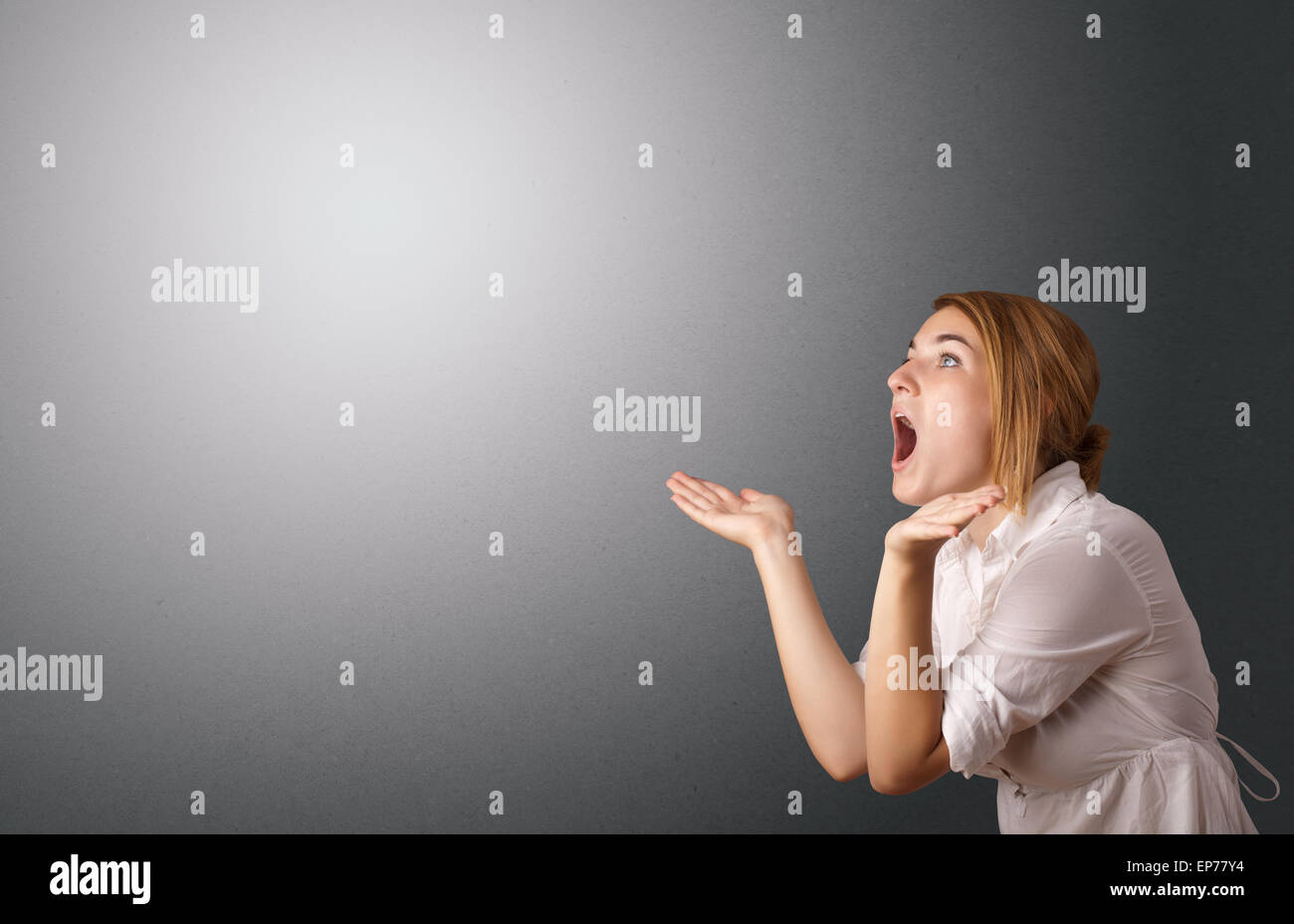 Young woman making gestures Stock Photo - Alamy