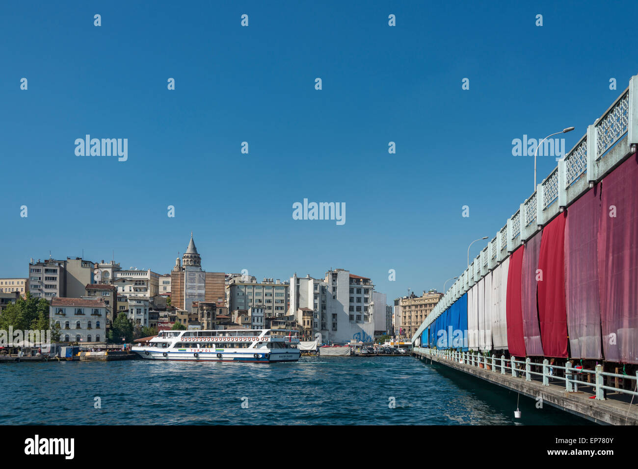 The Galata Bridge in central Istanbul with a ferry and the Galata Tower ...