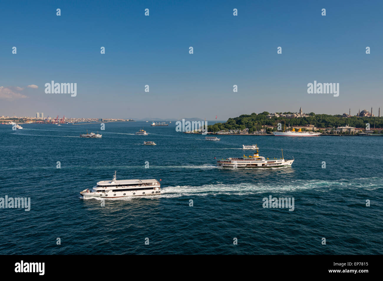 Ferries cris-crossing the Bosphorus Straits in Istanbul with the Hagia ...