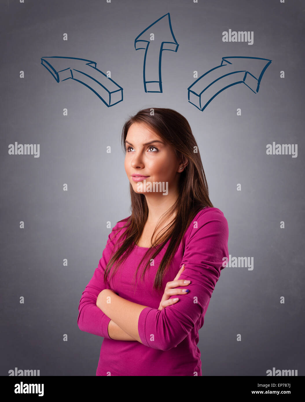 Pretty lady thinking with arrows overhead Stock Photo - Alamy