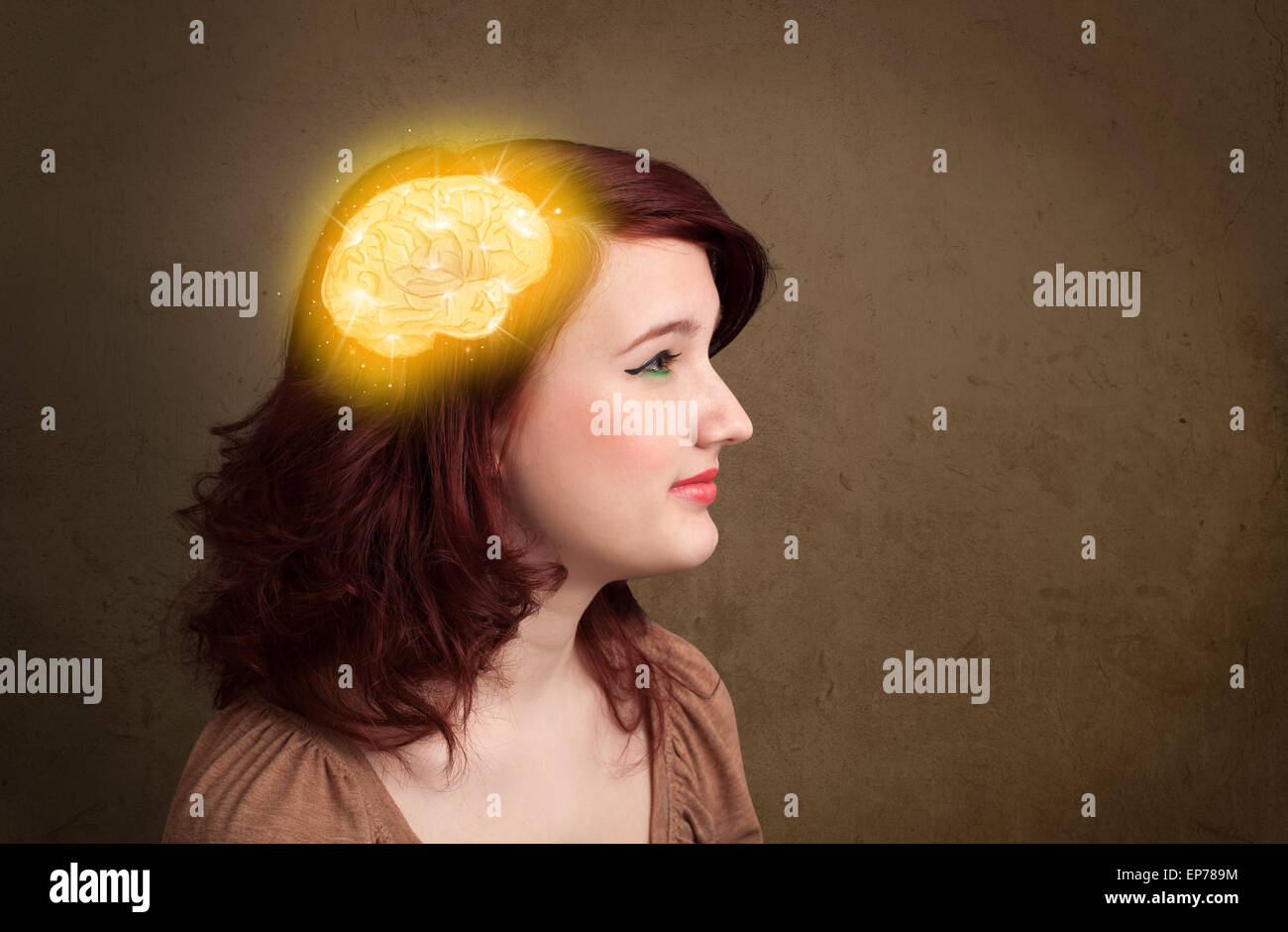 Young girl thinking with glowing brain illustration Stock Photo - Alamy