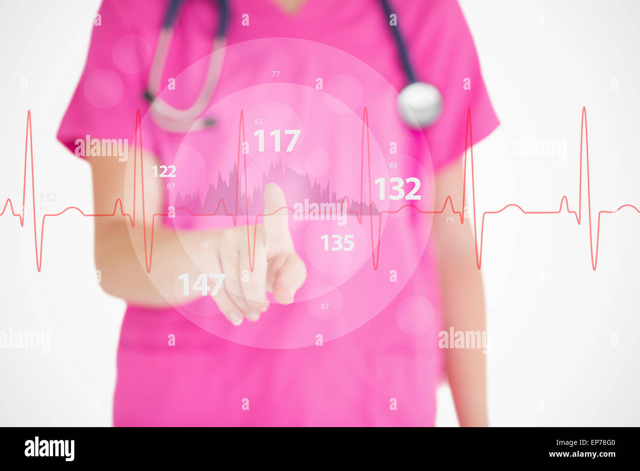 Nurse in pink scrubs touching red ECG line with figures Stock Photo - Alamy