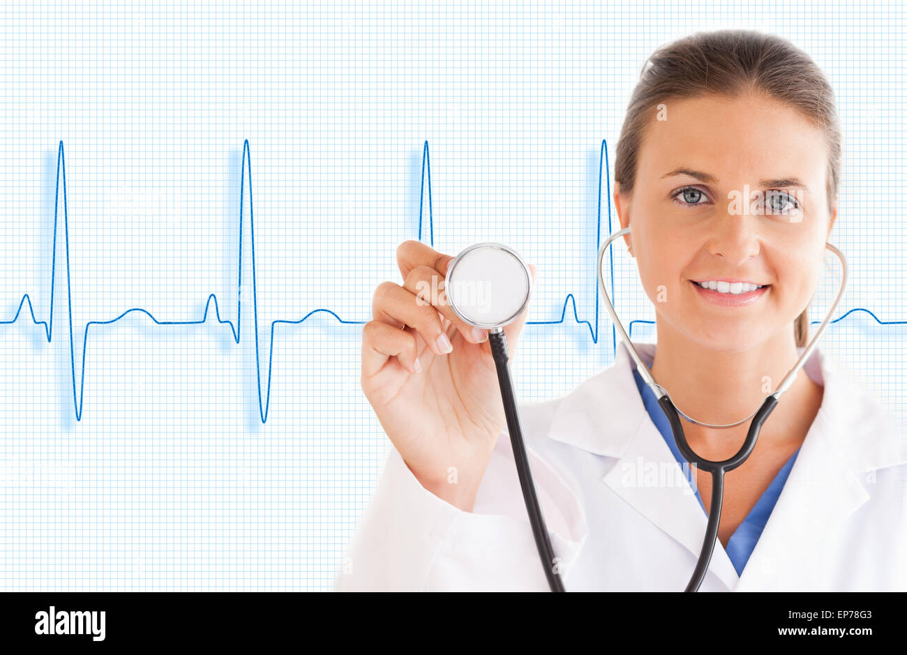 Doctor holding up stethoscope with blue ECG line Stock Photo - Alamy