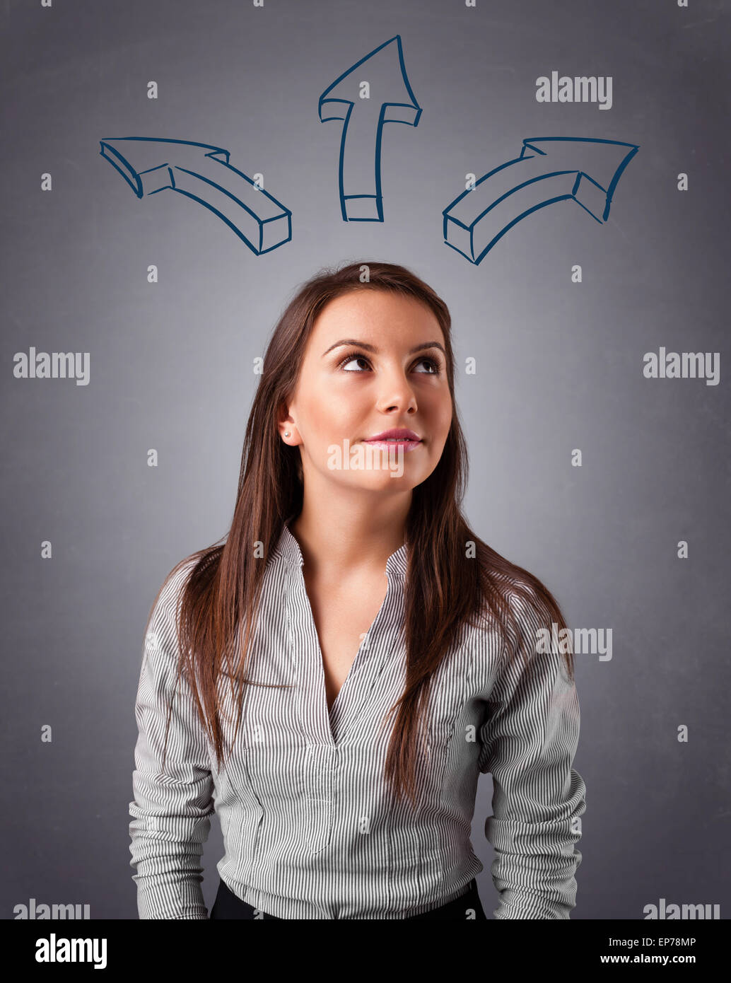 Pretty lady thinking with arrows overhead Stock Photo - Alamy
