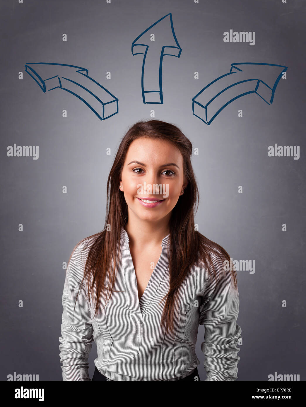 Pretty lady thinking with arrows overhead Stock Photo - Alamy