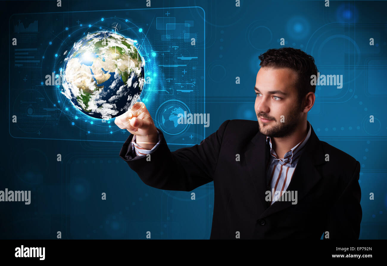 Young businessman touching high-tech 3d earth panel Stock Photo - Alamy