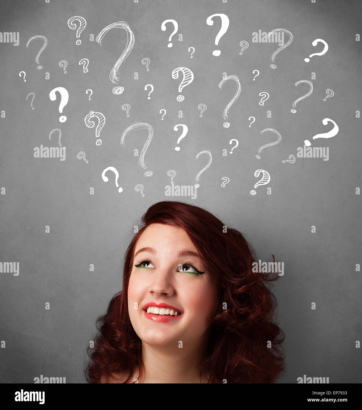 Young woman with question marks above her head Stock Photo - Alamy
