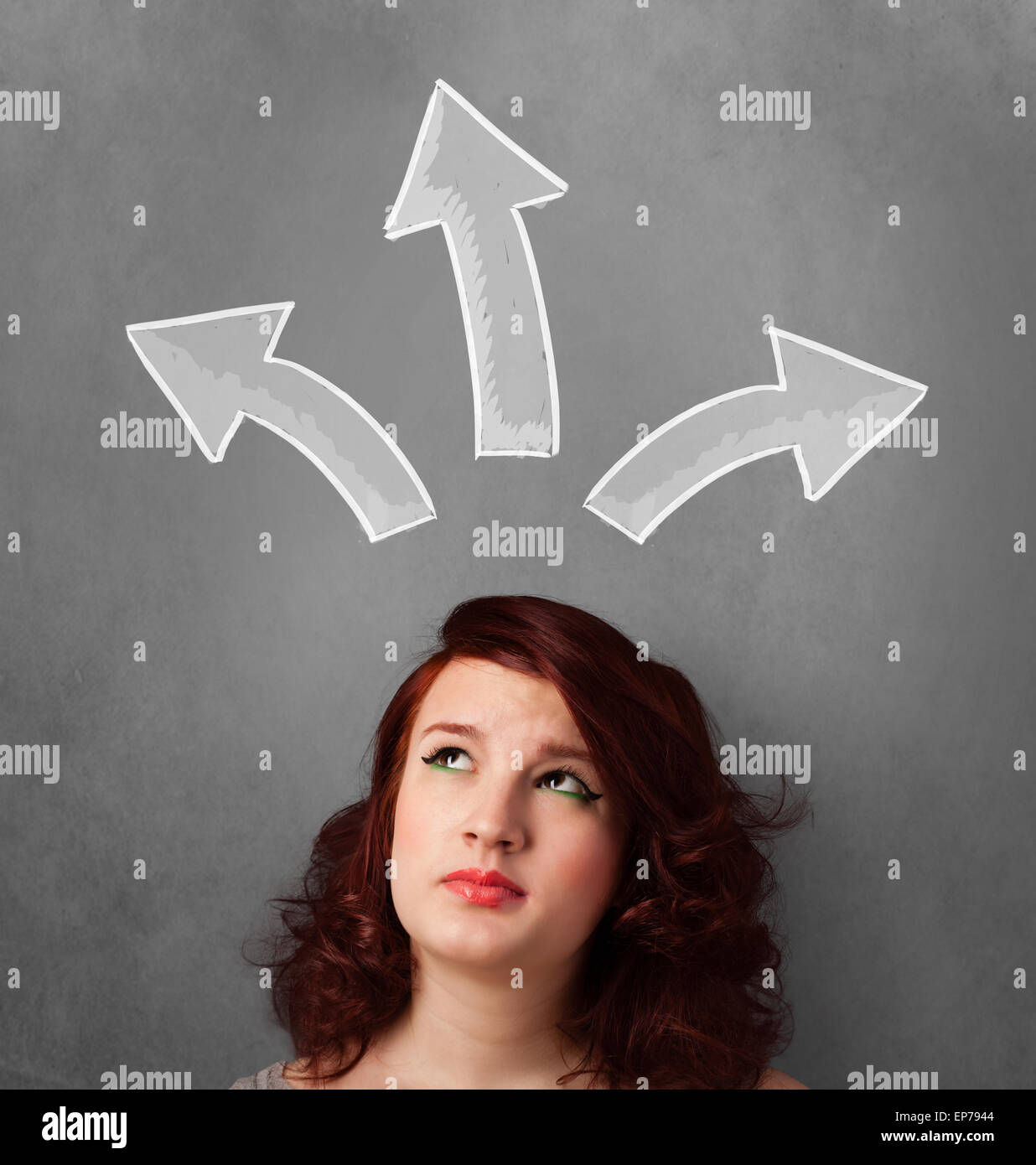 Young woman thinking with arrows above her head Stock Photo - Alamy