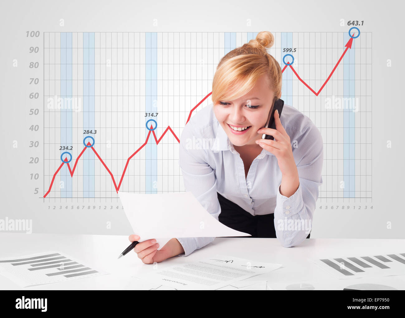 Young businesswoman calculating stock market with rising graph in the ...