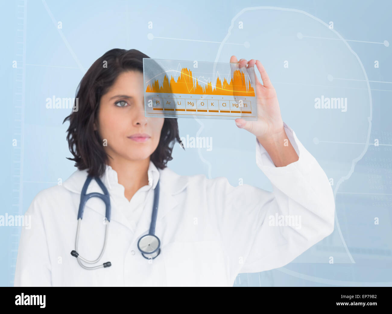 Brunette doctor looking at a graph with new technology Stock Photo - Alamy