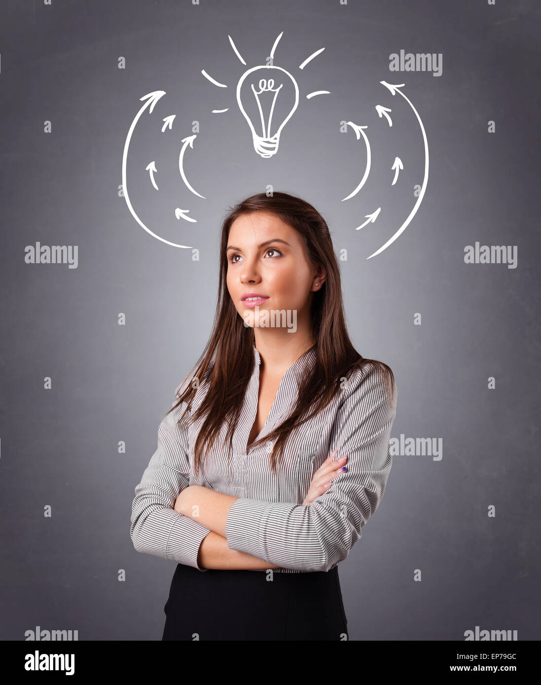 Pretty lady thinking with arrows and light bulb overhead Stock Photo ...