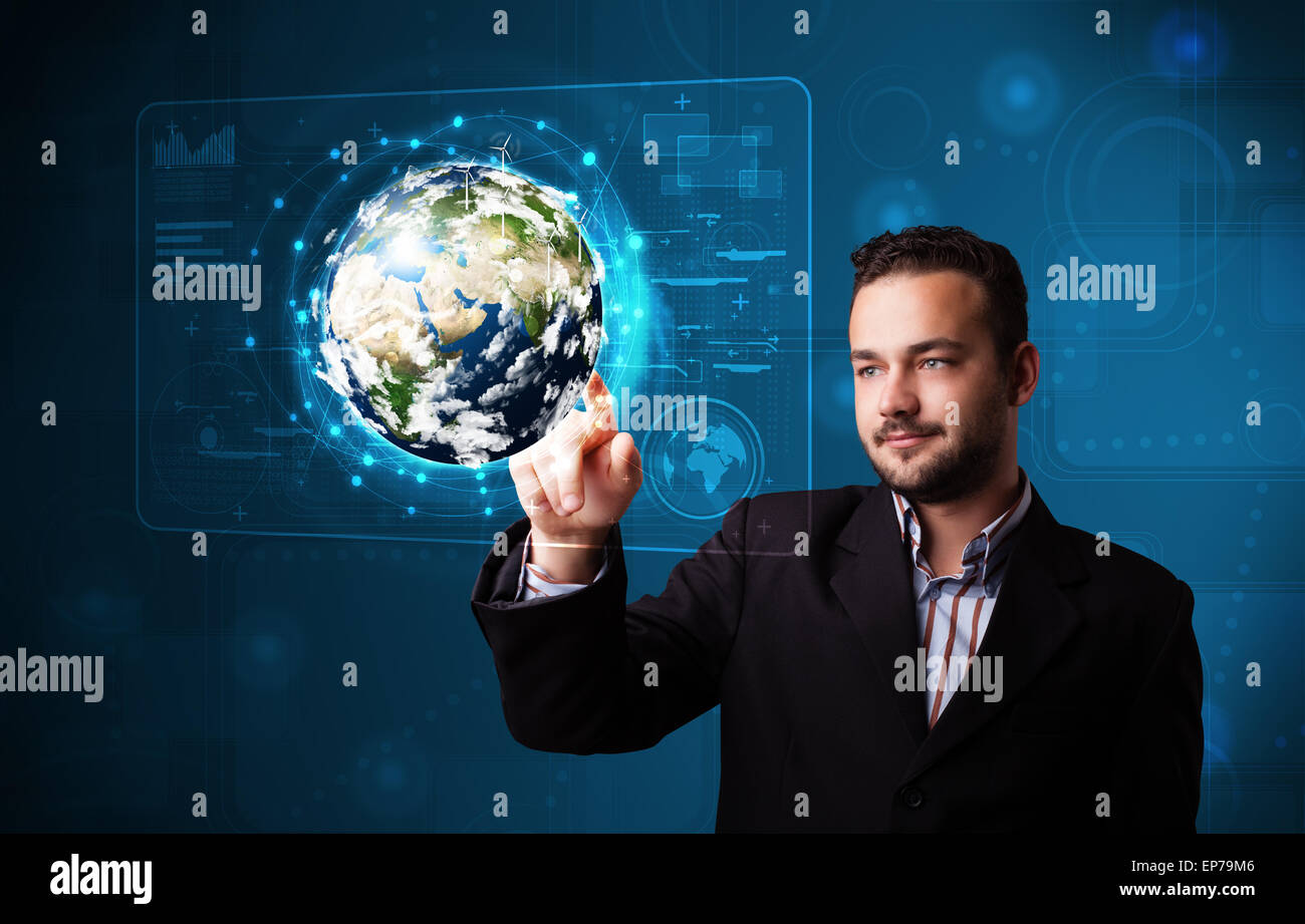 Young businessman touching high-tech 3d earth panel Stock Photo - Alamy
