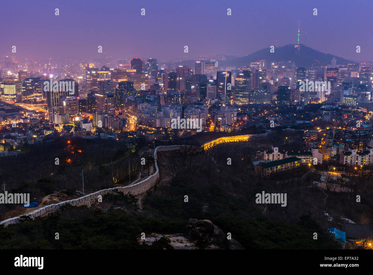 The view over downtown Seoul at dusk from atop Mount Inwangsan Stock ...