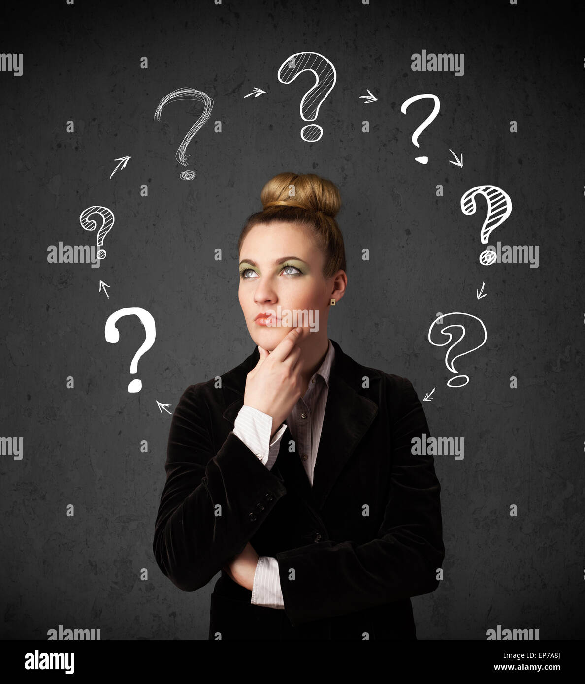 Young woman thinking with question mark circulation around her head ...