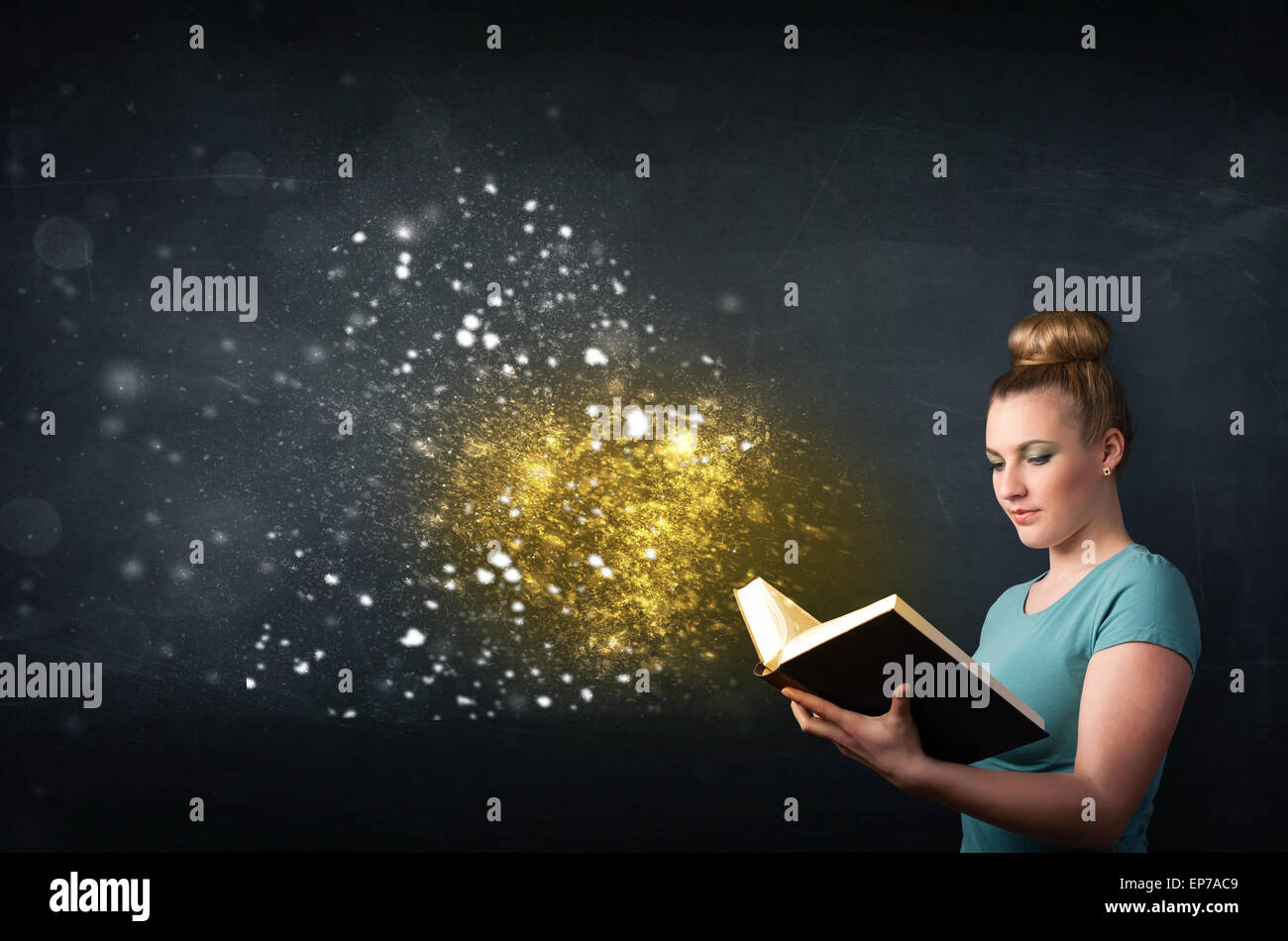 Young lady reading a magical book Stock Photo - Alamy