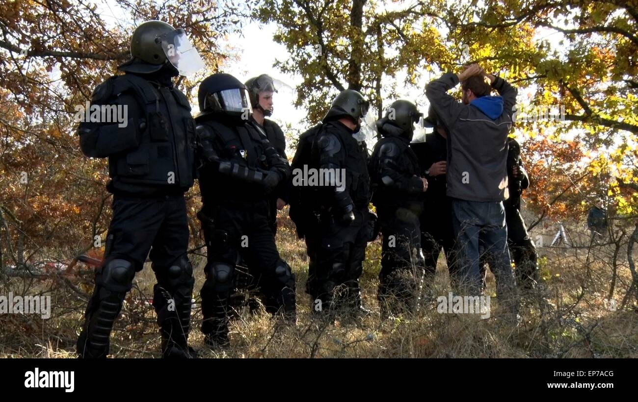 Bulgarian police officers guard a group of German activists at the ...