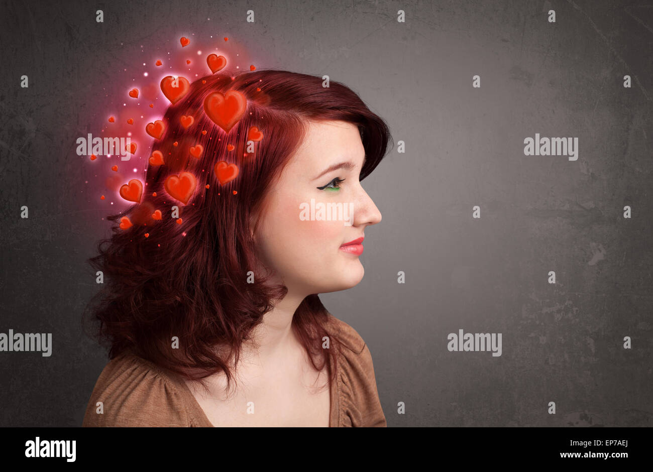 Young person thinking about love with red hearts Stock Photo - Alamy