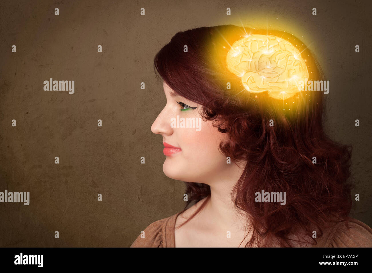 Young girl thinking with glowing brain illustration Stock Photo - Alamy